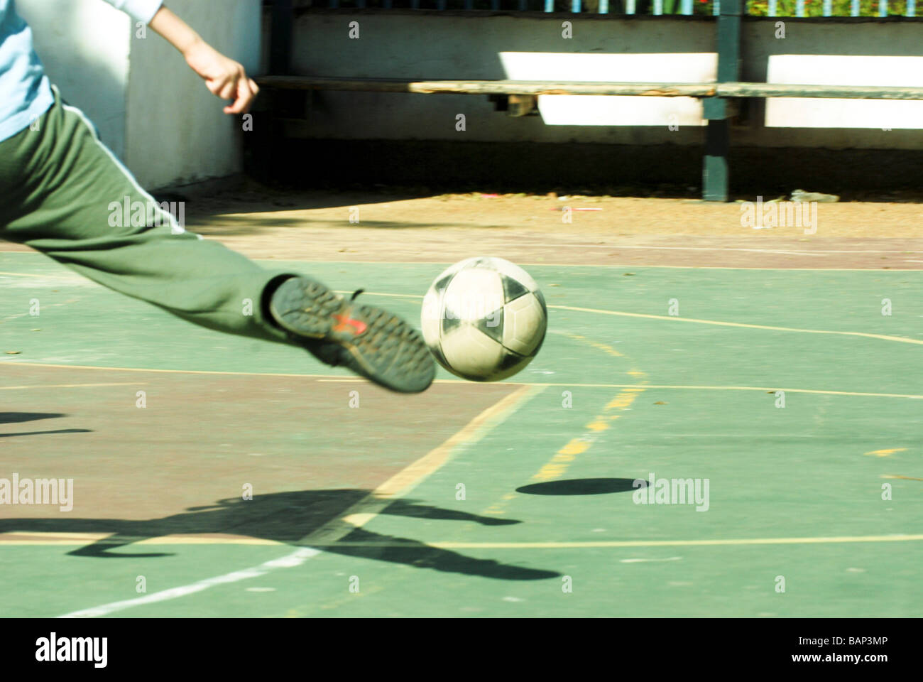 Children playing soccer in a school yard Stock Photo - Alamy