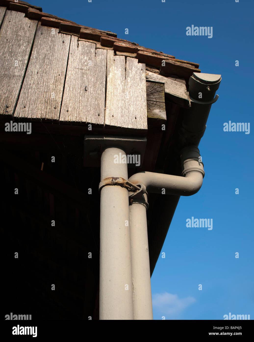A drainpipe on the roof of a building Stock Photo - Alamy