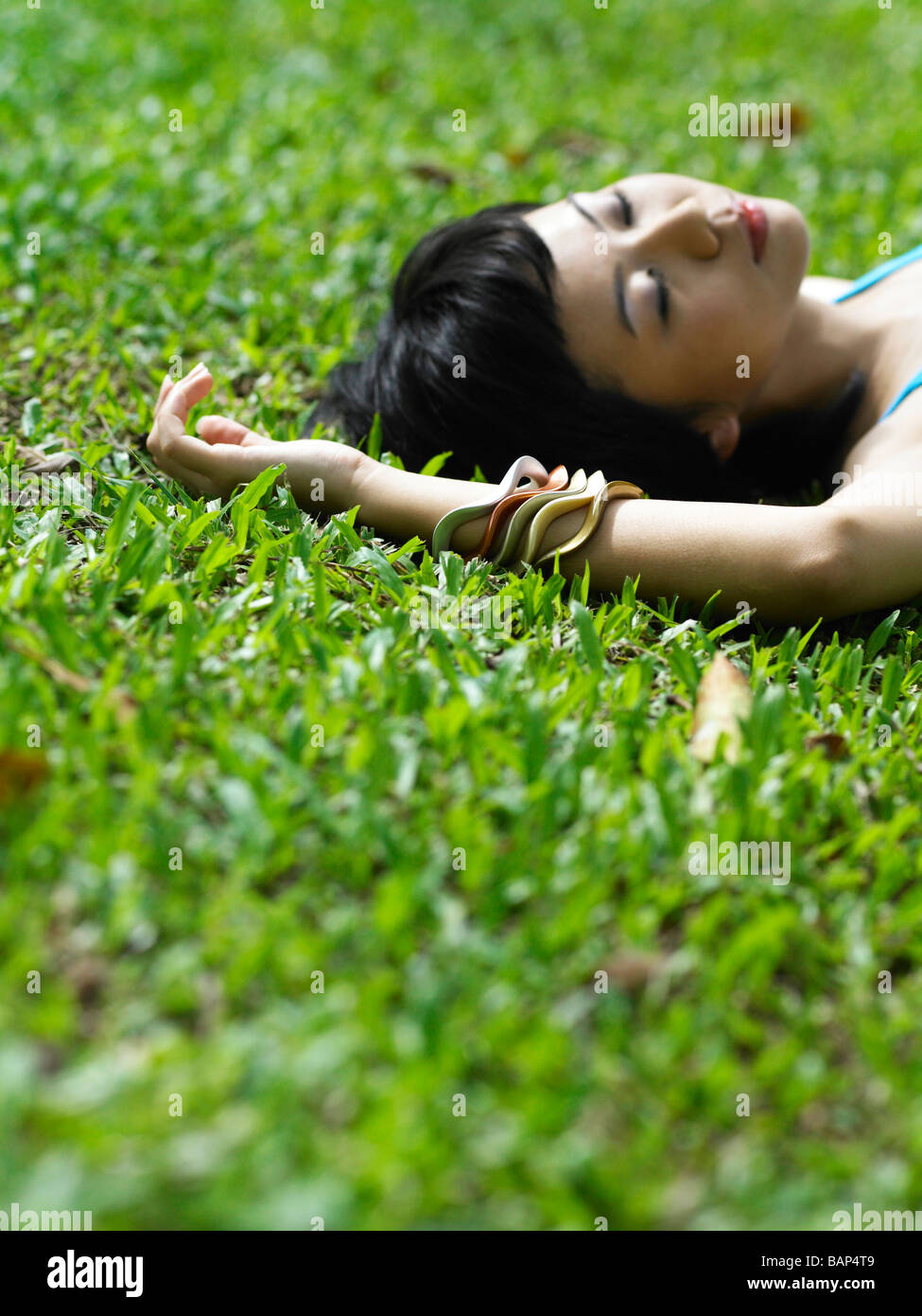 woman lay on the back at park Stock Photo - Alamy