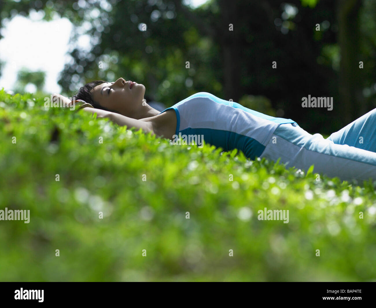 woman lay on the back at park Stock Photo - Alamy