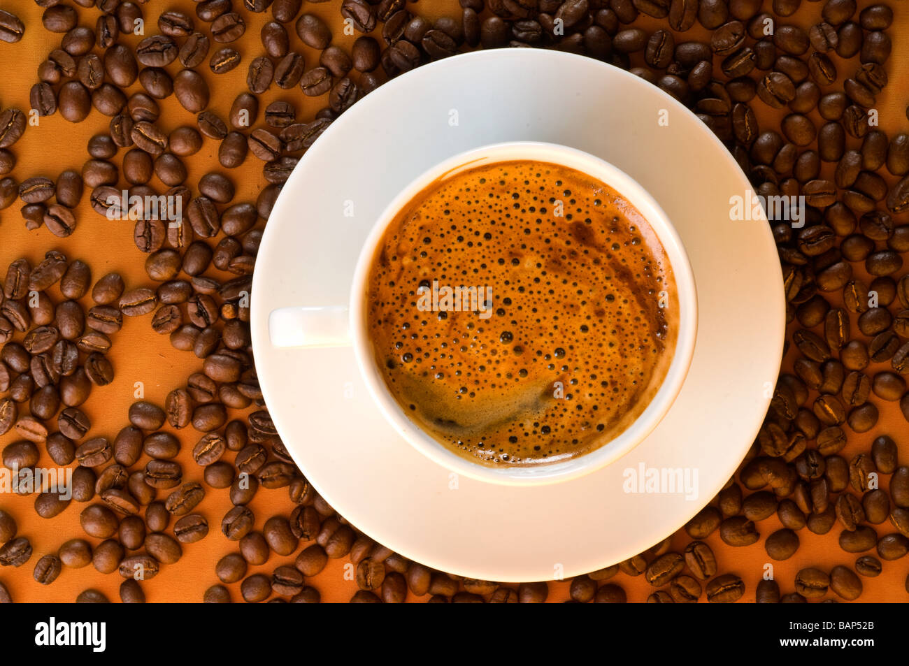 Coffee with on a gold background Stock Photo - Alamy