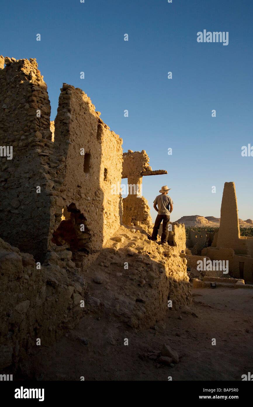 Siwa Oasis, Egypt; Man wearing a hat at the Temple of the Oracle of ...