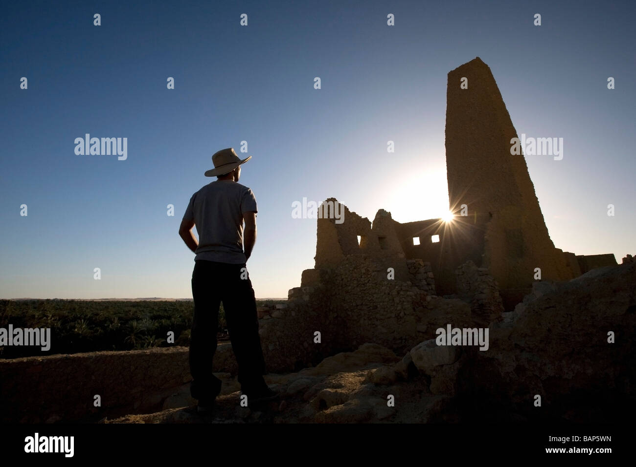 Siwa Oasis, Egypt; Man wearing a hat at the Temple of the Oracle of ...