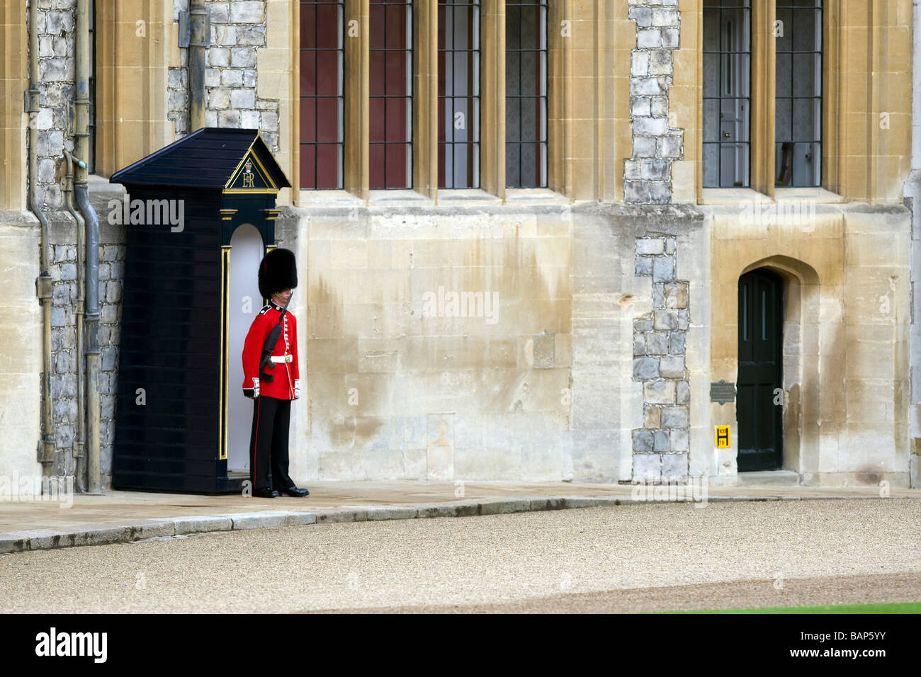 A sentry on duty on the Quadrangle in Windsor Castle in Berkshire UK ...