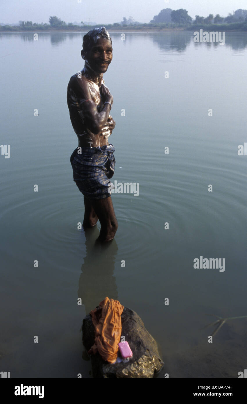 Indian man washing in pond hi-res stock photography and images - Alamy