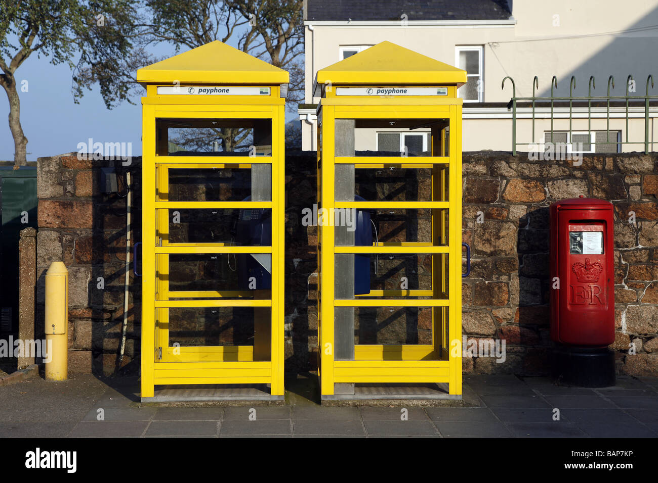 Yellow telephone box hi-res stock photography and images - Alamy