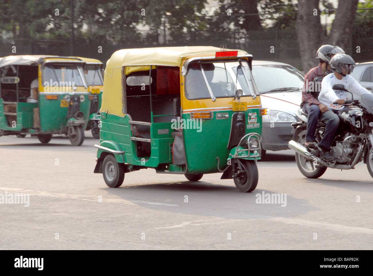 Auto rickshaws in busy traffic in Delhi India Stock Photo - Alamy