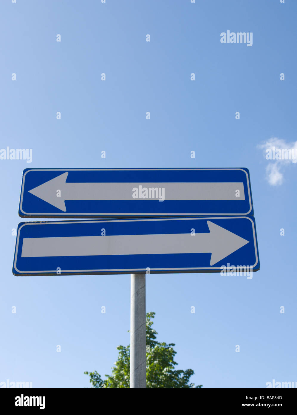 Road sign with two one way signs indicating opposite directions Stock ...