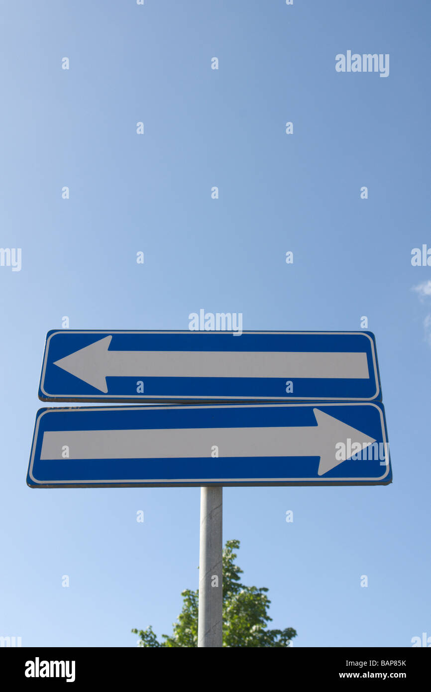 Road sign with two one way signs indicating opposite directions Stock ...