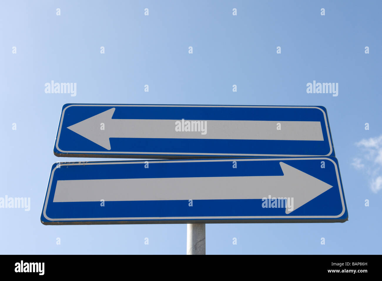 Road sign with two one way signs indicating opposite directions Stock ...