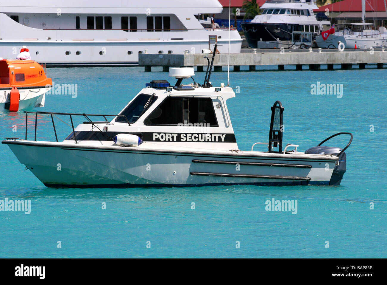 Port security motor boat speeding across the bay Stock Photo - Alamy