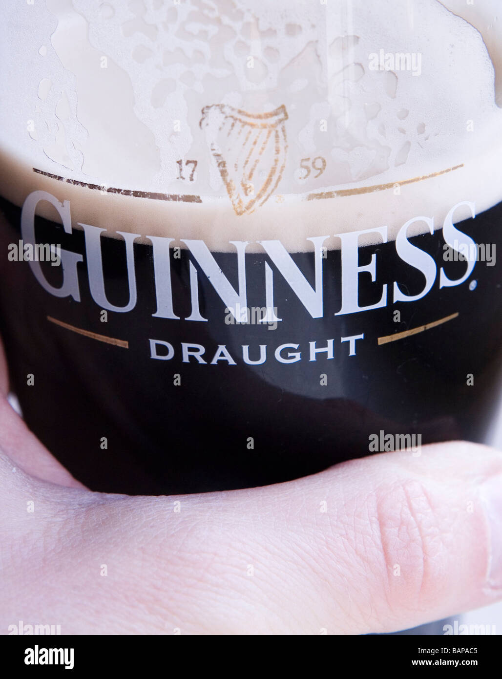 A half drunk pint glass of Guinness Stock Photo - Alamy