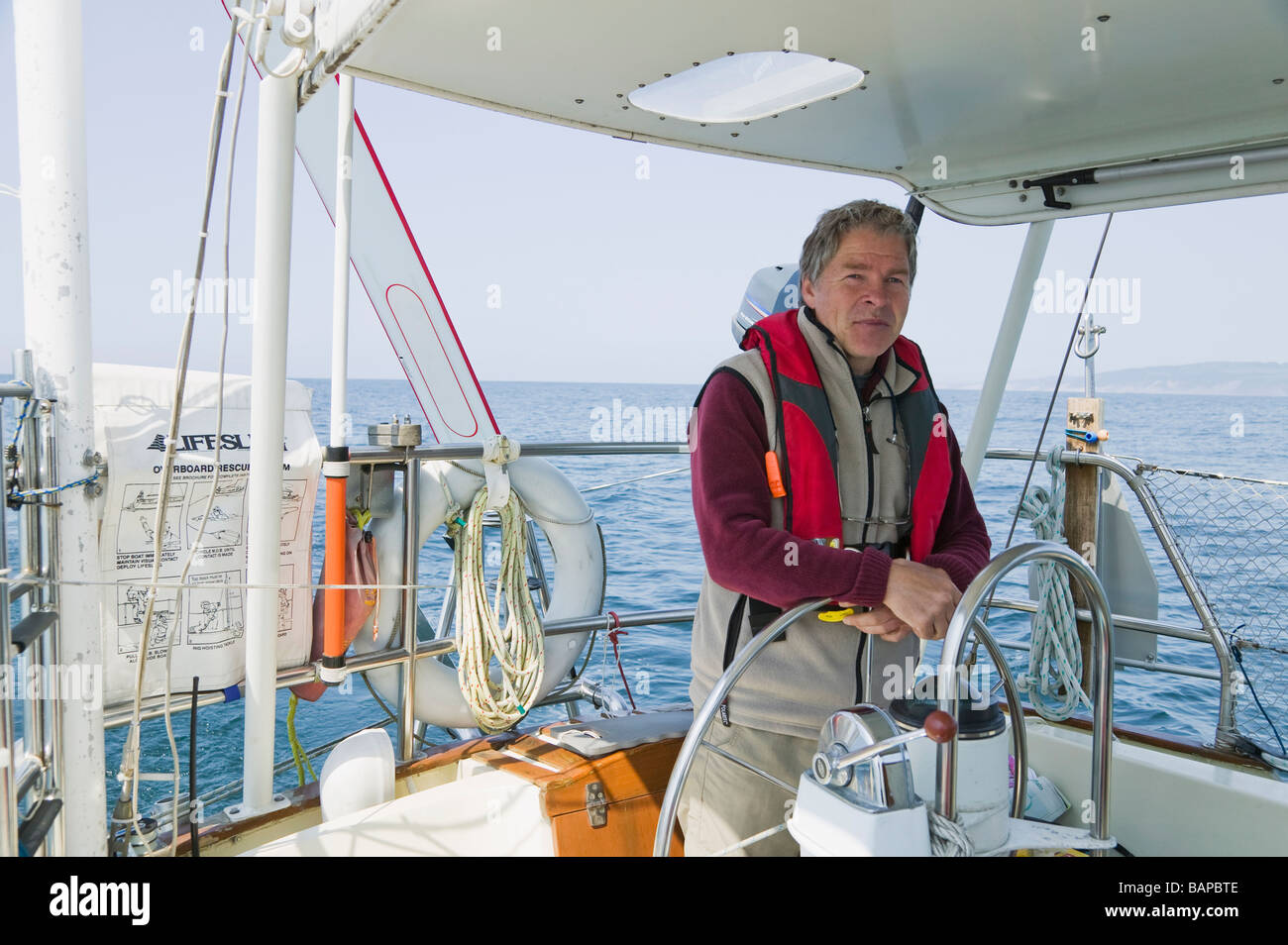 Man at helm hi-res stock photography and images - Alamy