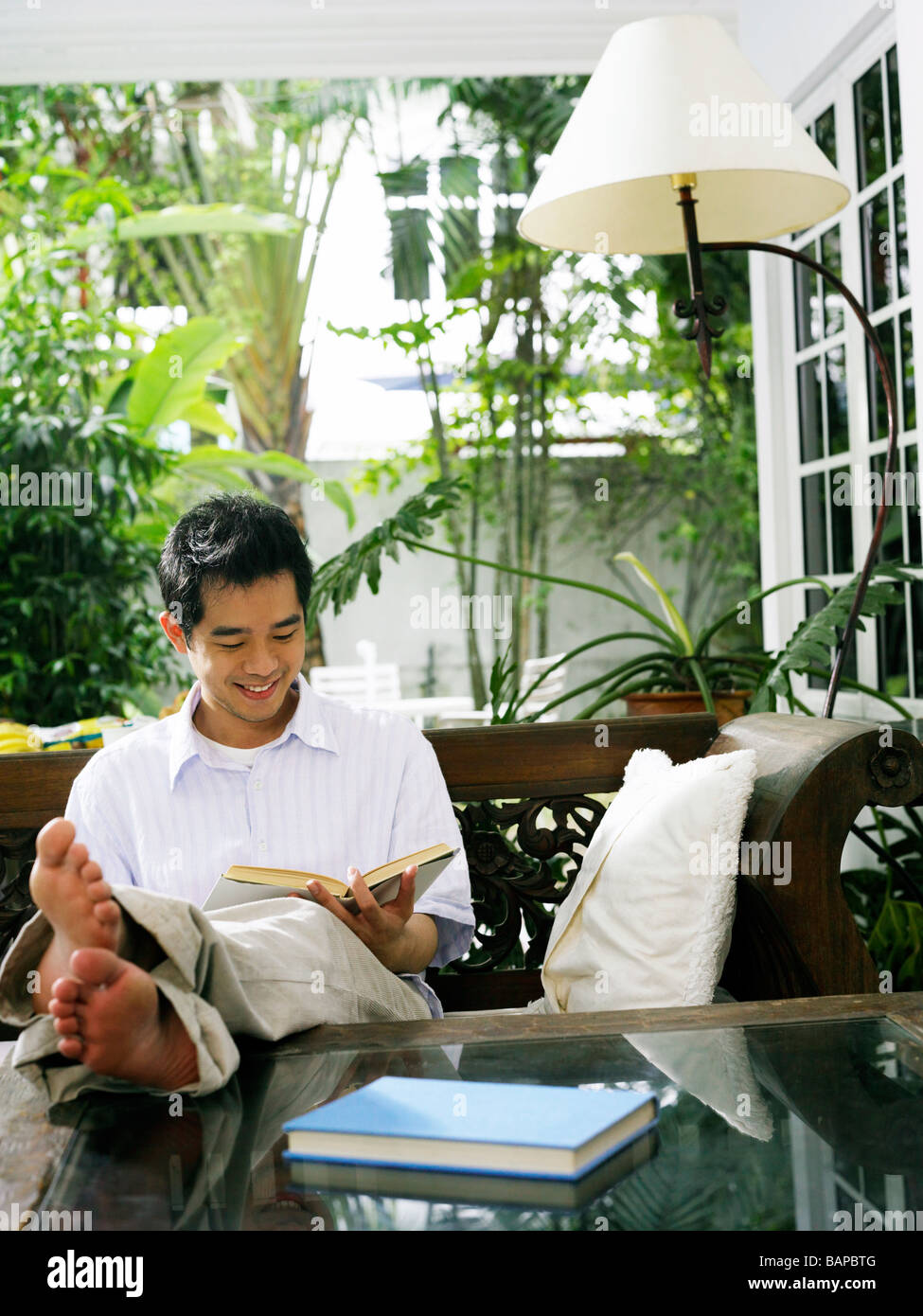 man enjoying reading book at garden Stock Photo - Alamy