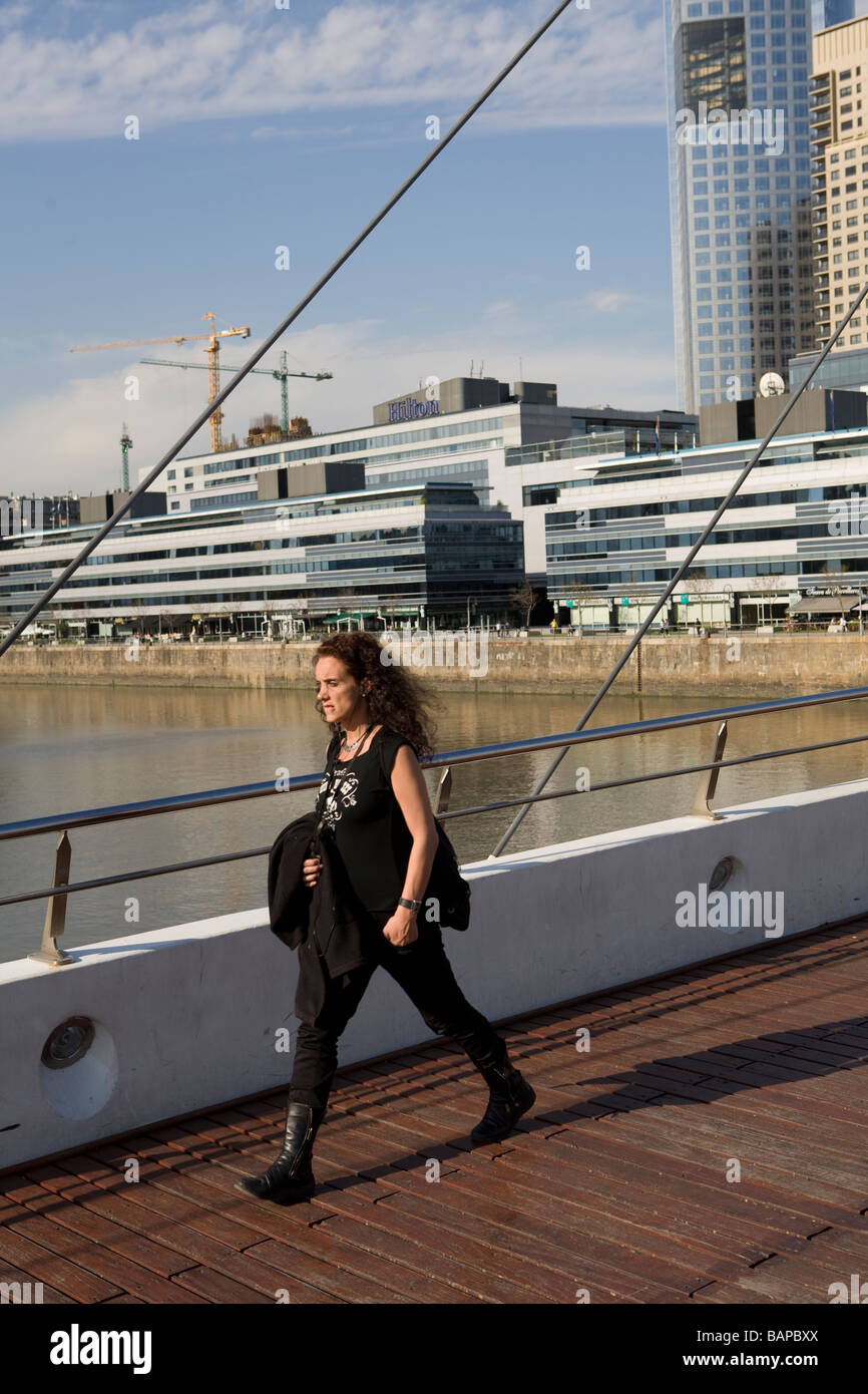 Woman walking over the Puente de la Mujer (Woman Bridge) in Puerto ...