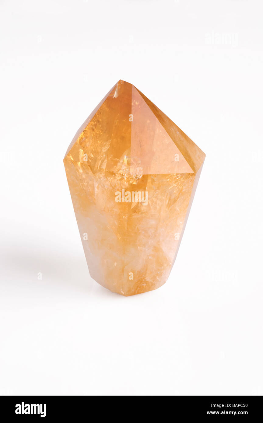 Citrine quartz crystal on white background Stock Photo - Alamy
