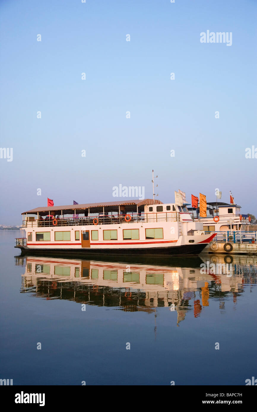 Reflection of tourboats in a lake, Hussain Sagar, Hyderabad, Andhra ...