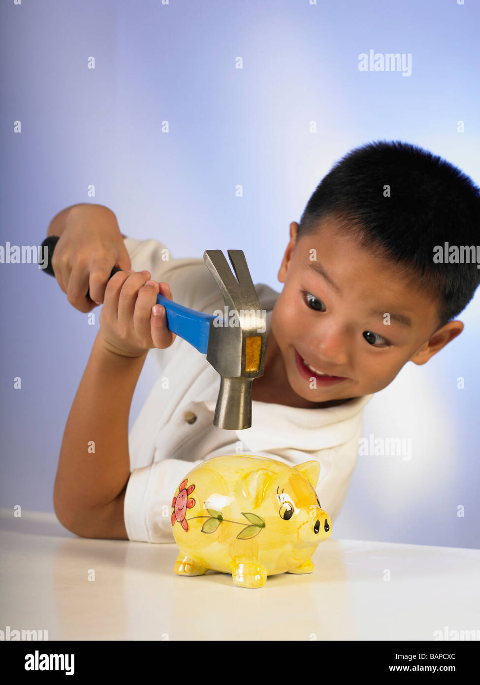 boy is breaking the the piggy bank Stock Photo - Alamy