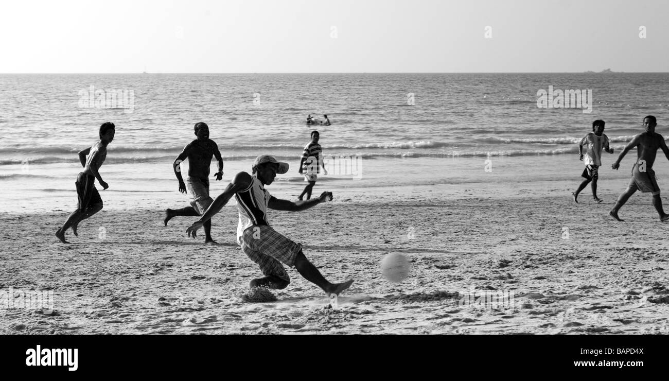 playing football on a beach Stock Photo - Alamy