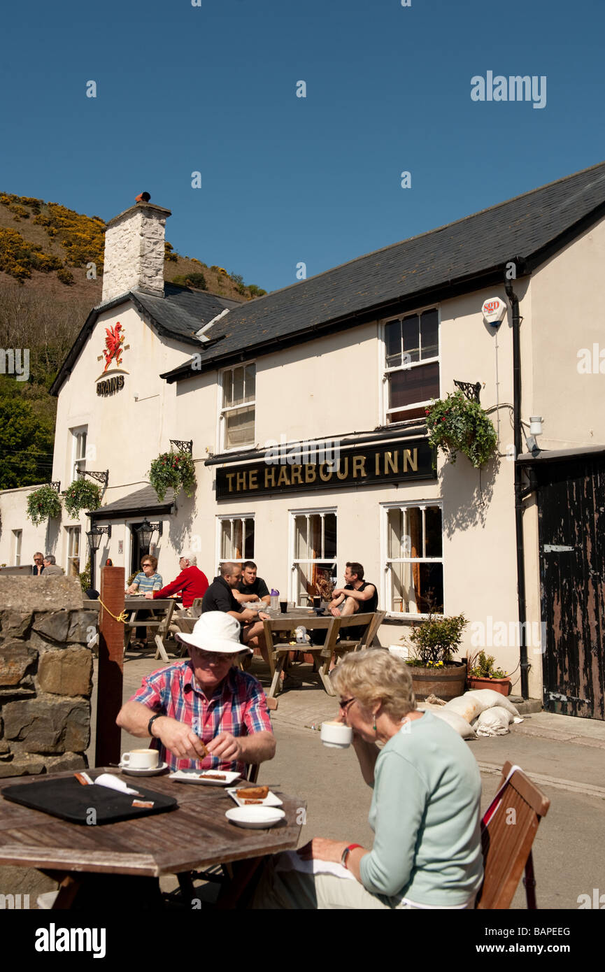 people drinking coffee sitting outside The Harbour Inn pub Solva ...