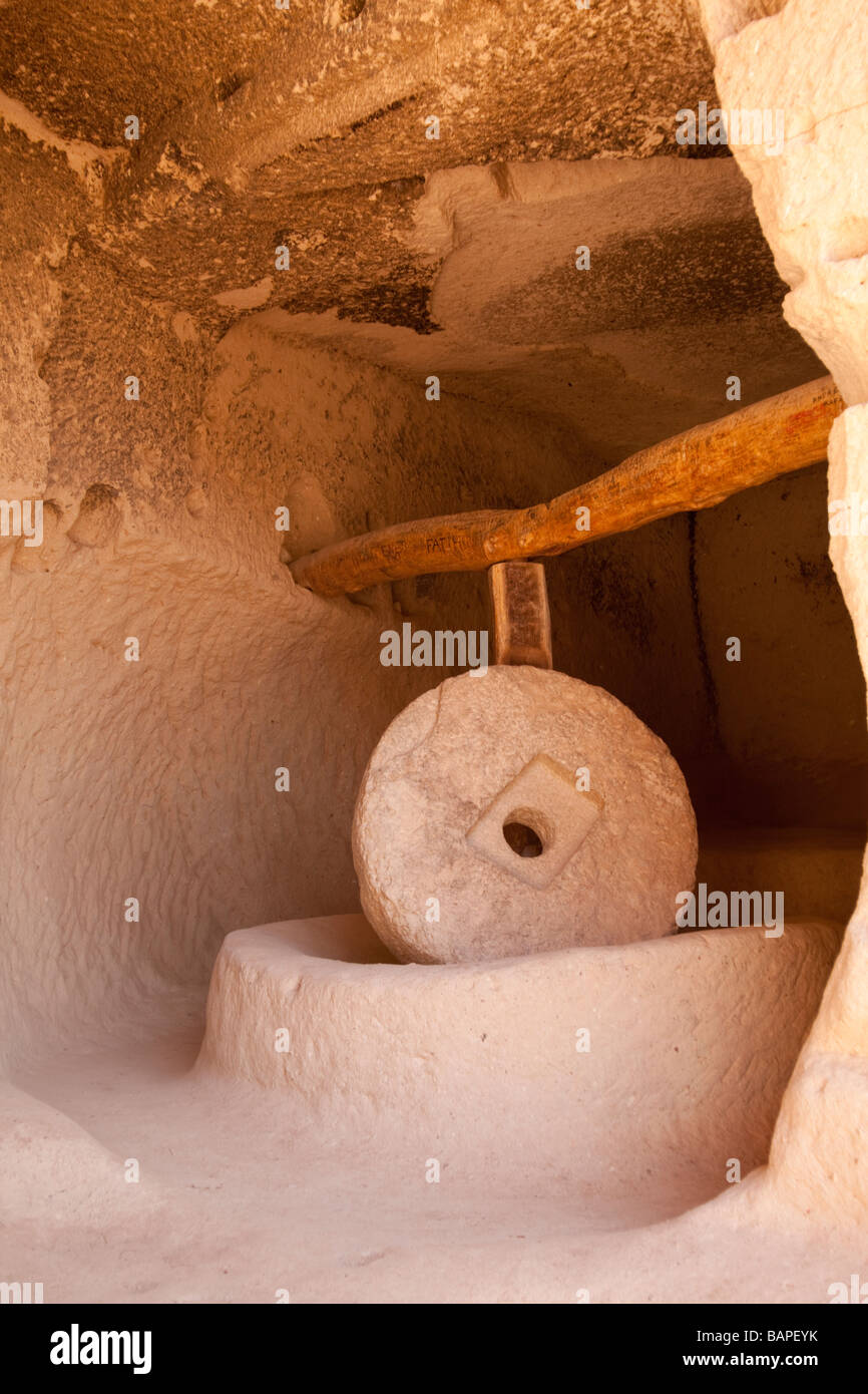 Old millstone at ancient cave home near Goreme in Cappadocia Turkey ...