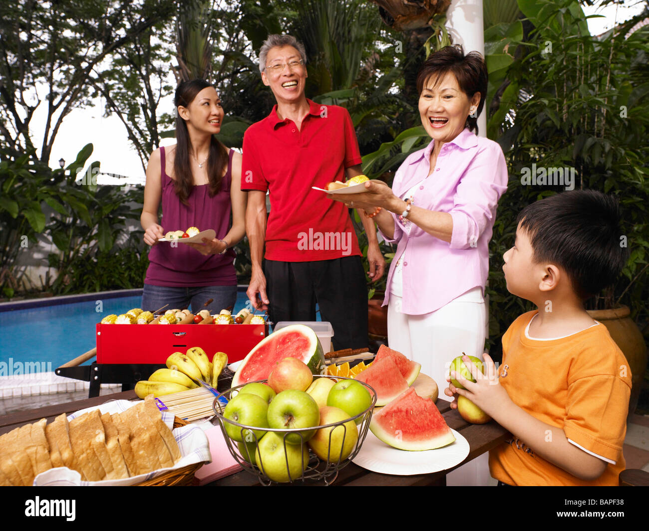 family having a celebration at poolside Stock Photo - Alamy