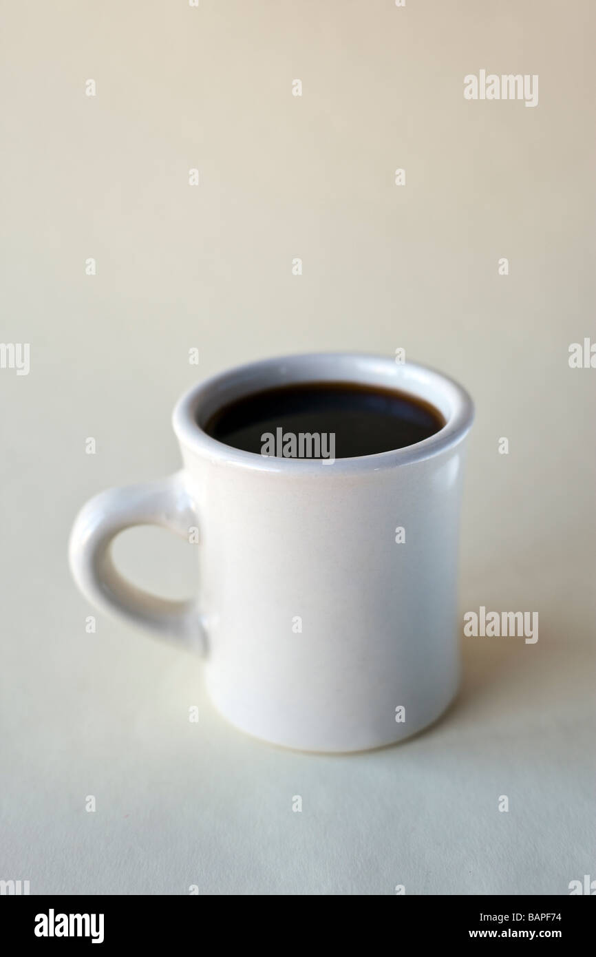 Cup of coffee on background in studio Stock Photo - Alamy