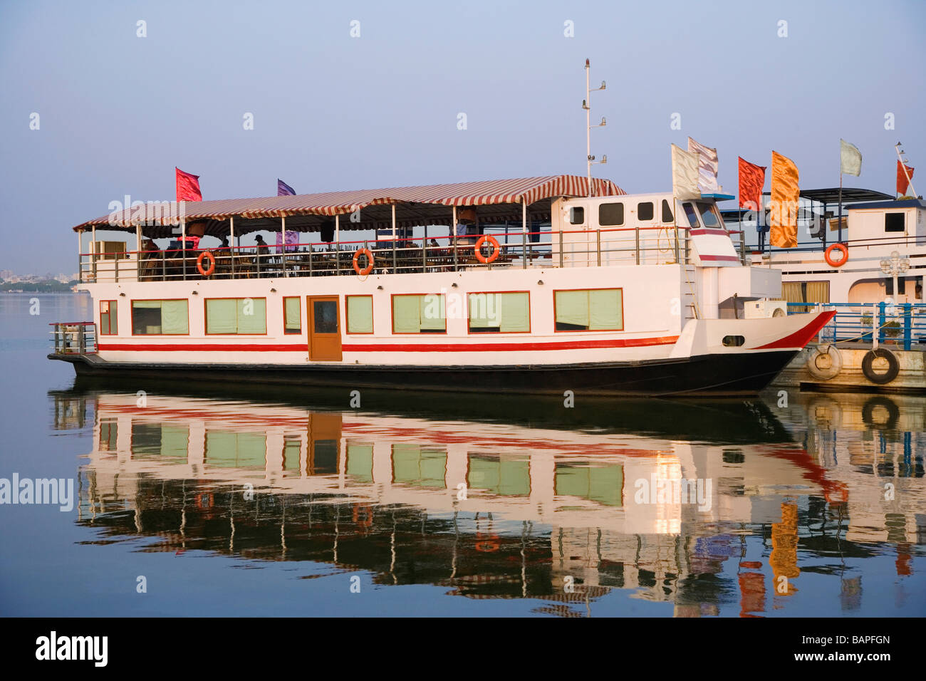 Reflection of tourboats in the lake, Hussain Sagar, Hyderabad, Andhra ...