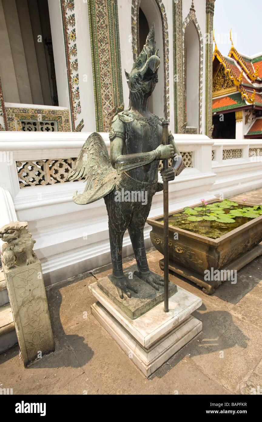 A Bronze Mythological Creature guards the entrance to a Pagoda in Wat ...