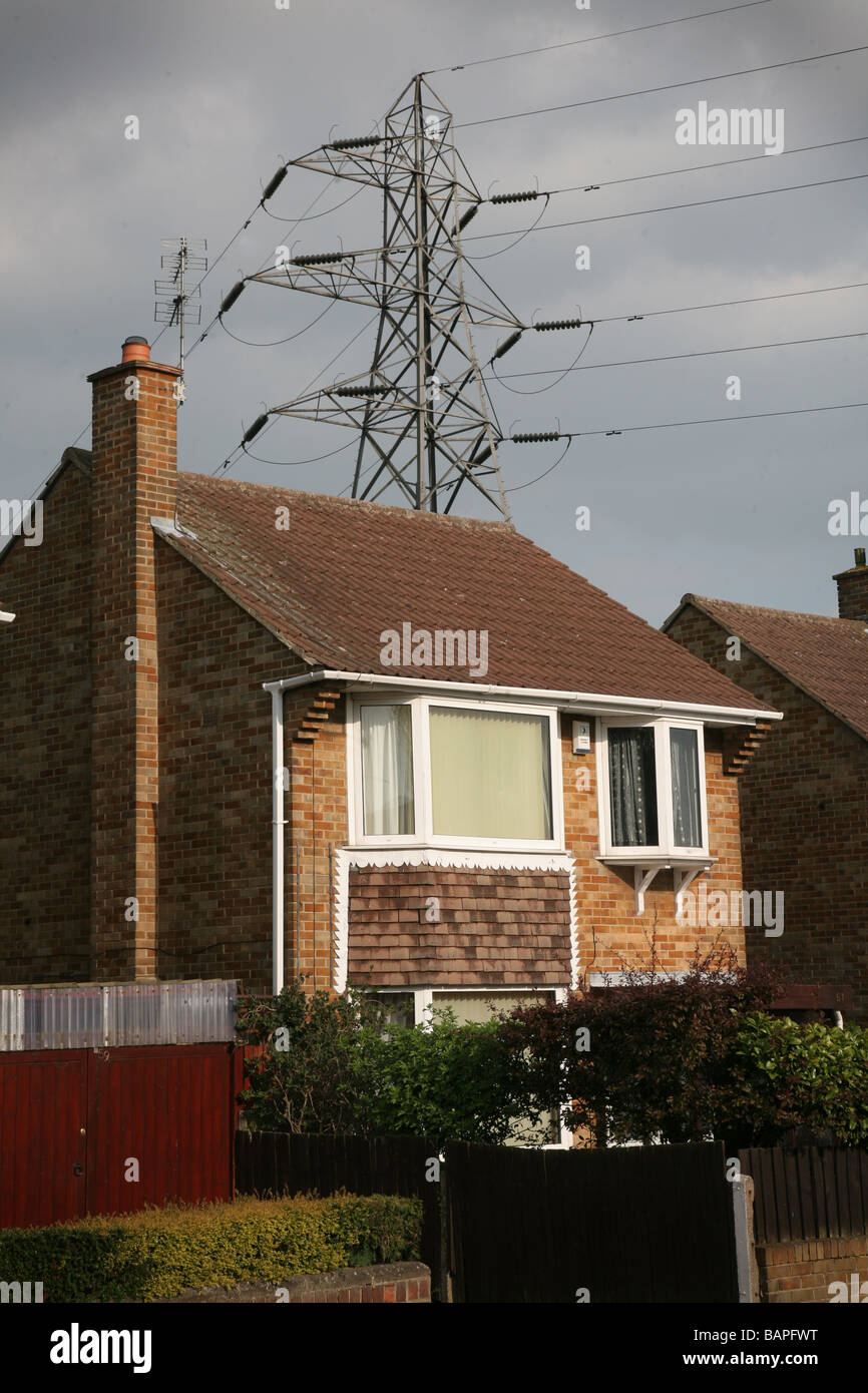 Pylon near housing Stock Photo - Alamy