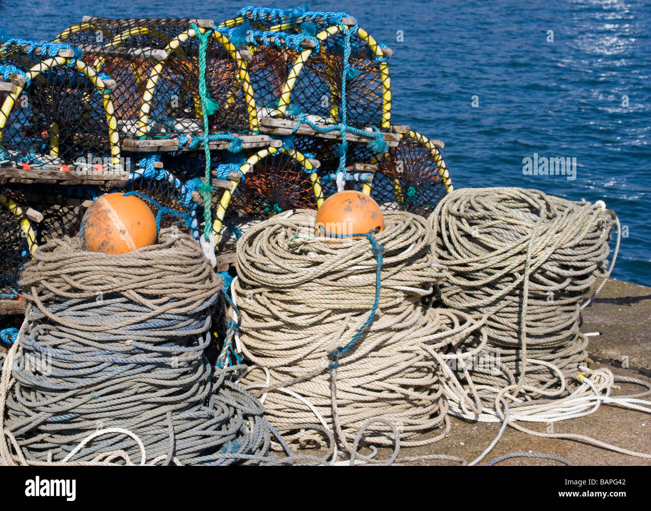 Lobster pots and coiled rope on Stonehaven harbour Stock Photo - Alamy