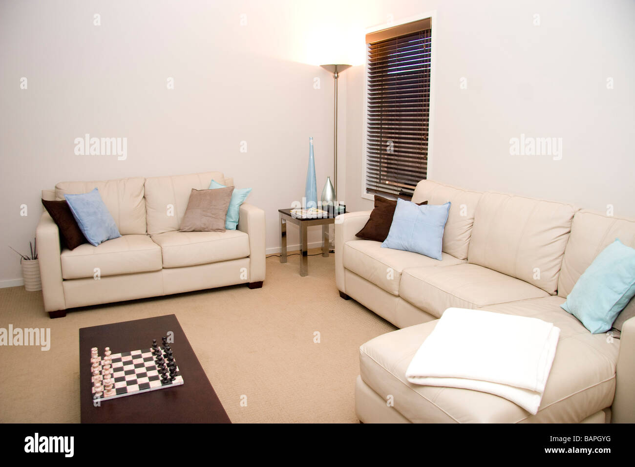 Modern living room with chess set Stock Photo - Alamy
