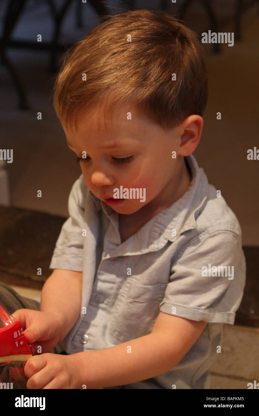 Young boy playing Stock Photo - Alamy