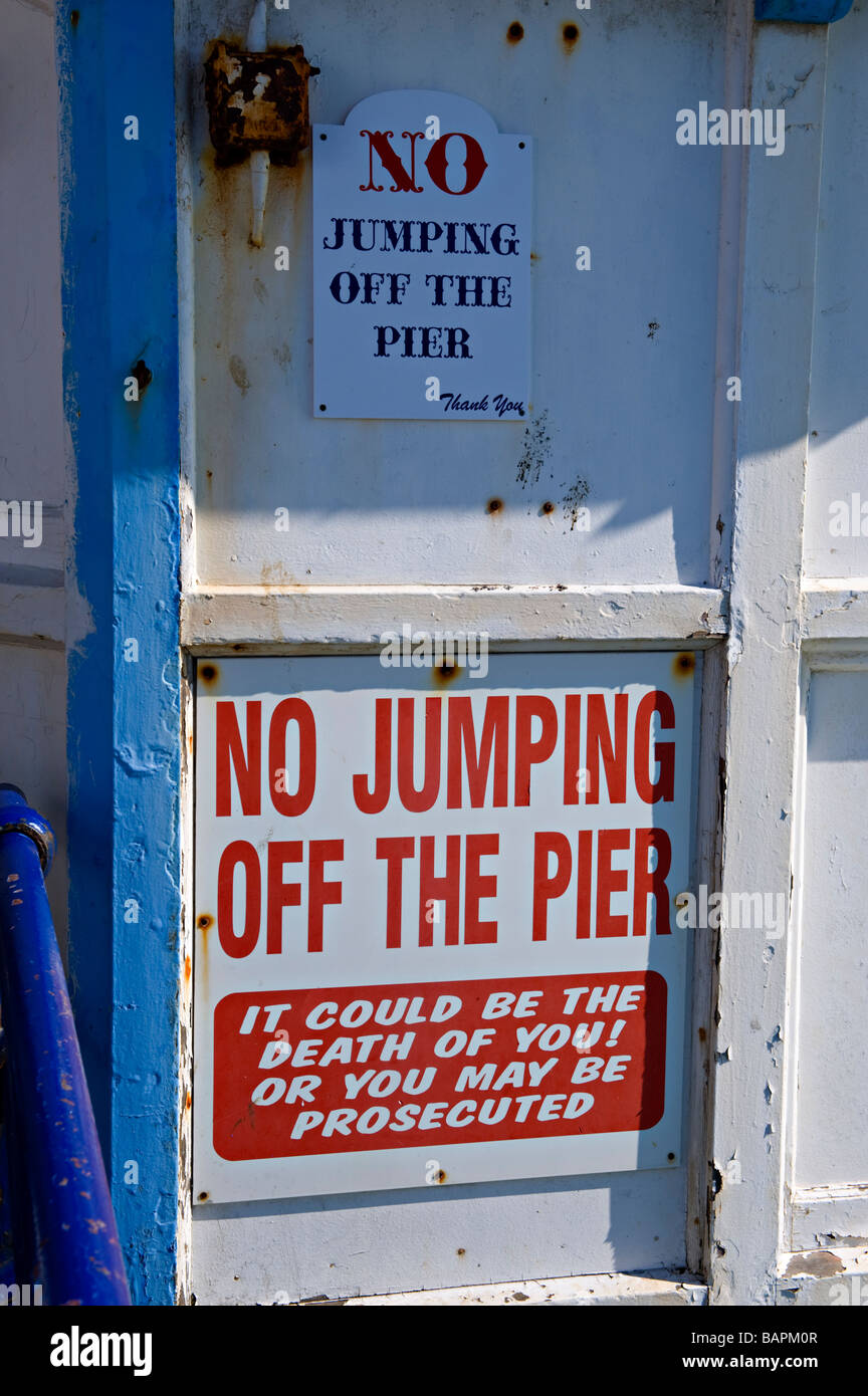 Warning Sign on Eastbourne Pier Stock Photo - Alamy