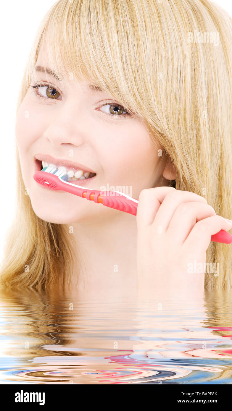 picture of happy girl with toothbrush in water Stock Photo - Alamy