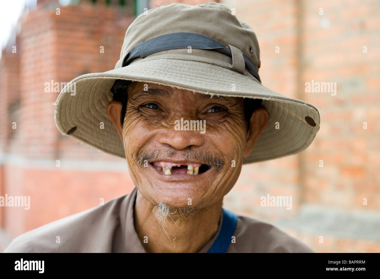 Portrait of a smiling Vietnamese Man by the Cham Tower Complex, Nha ...