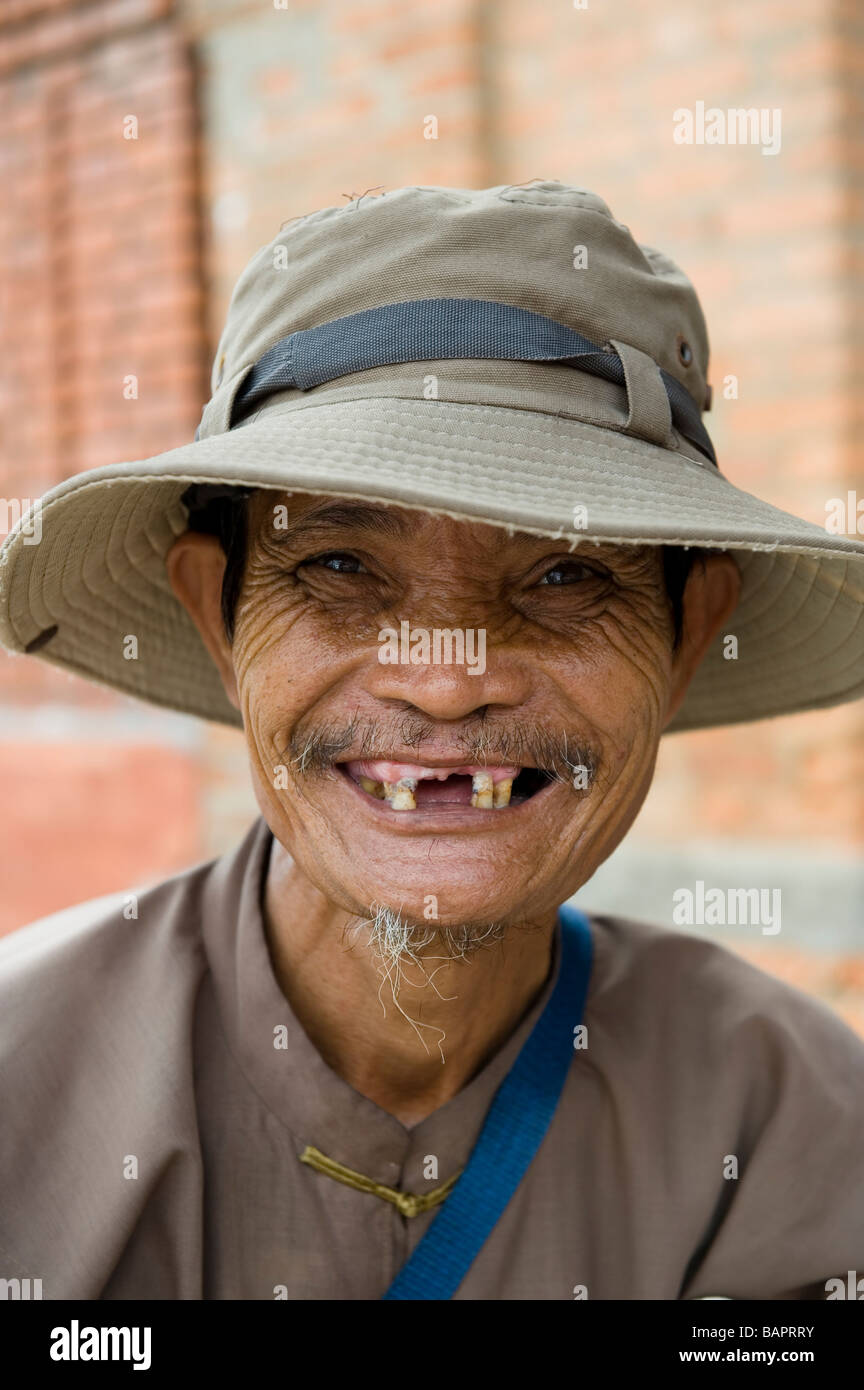 Portrait of a smiling Vietnamese Man by the Cham Tower Complex, Nha ...