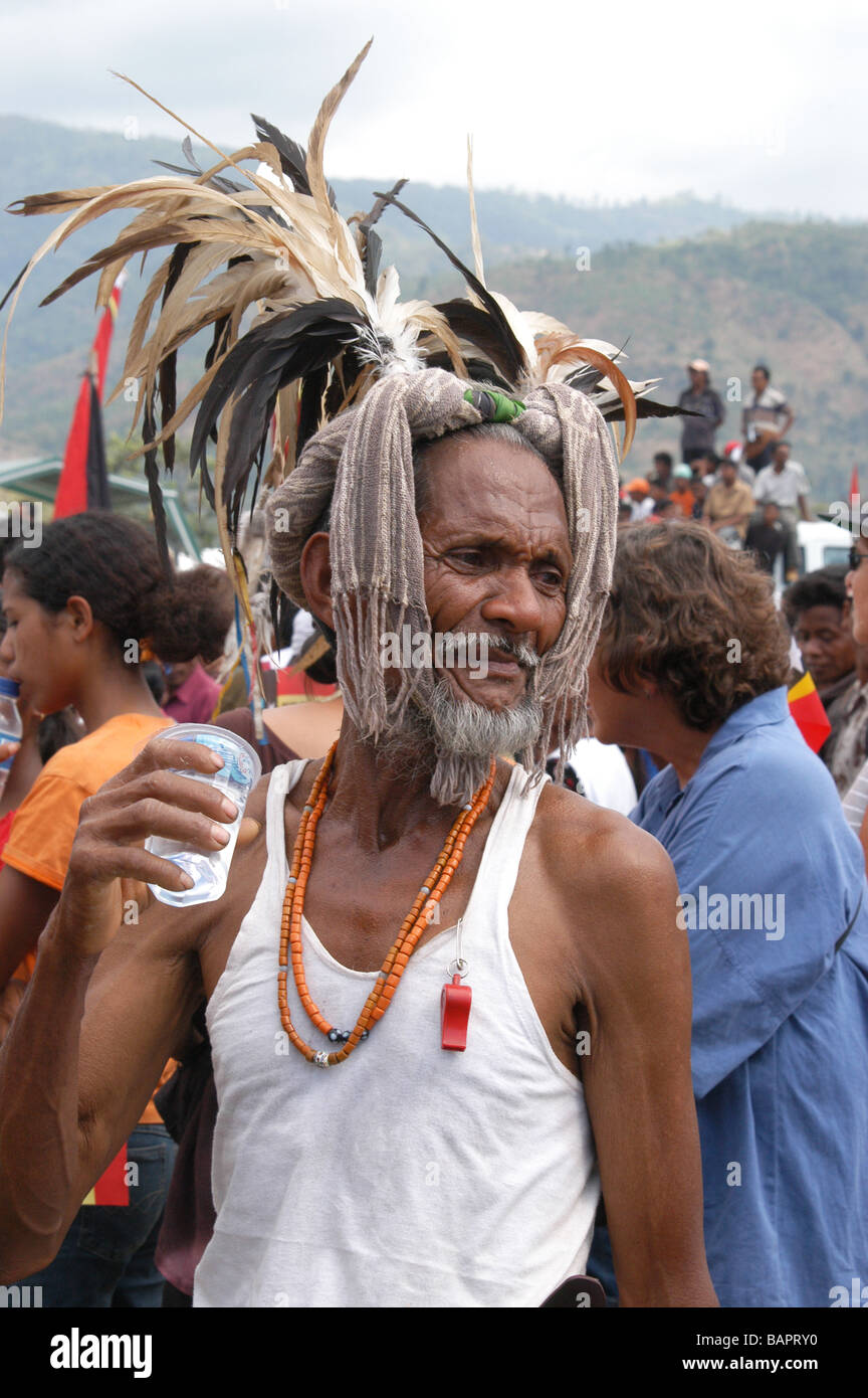 East Timorese warrior in a traditional headdress made from cockerel ...
