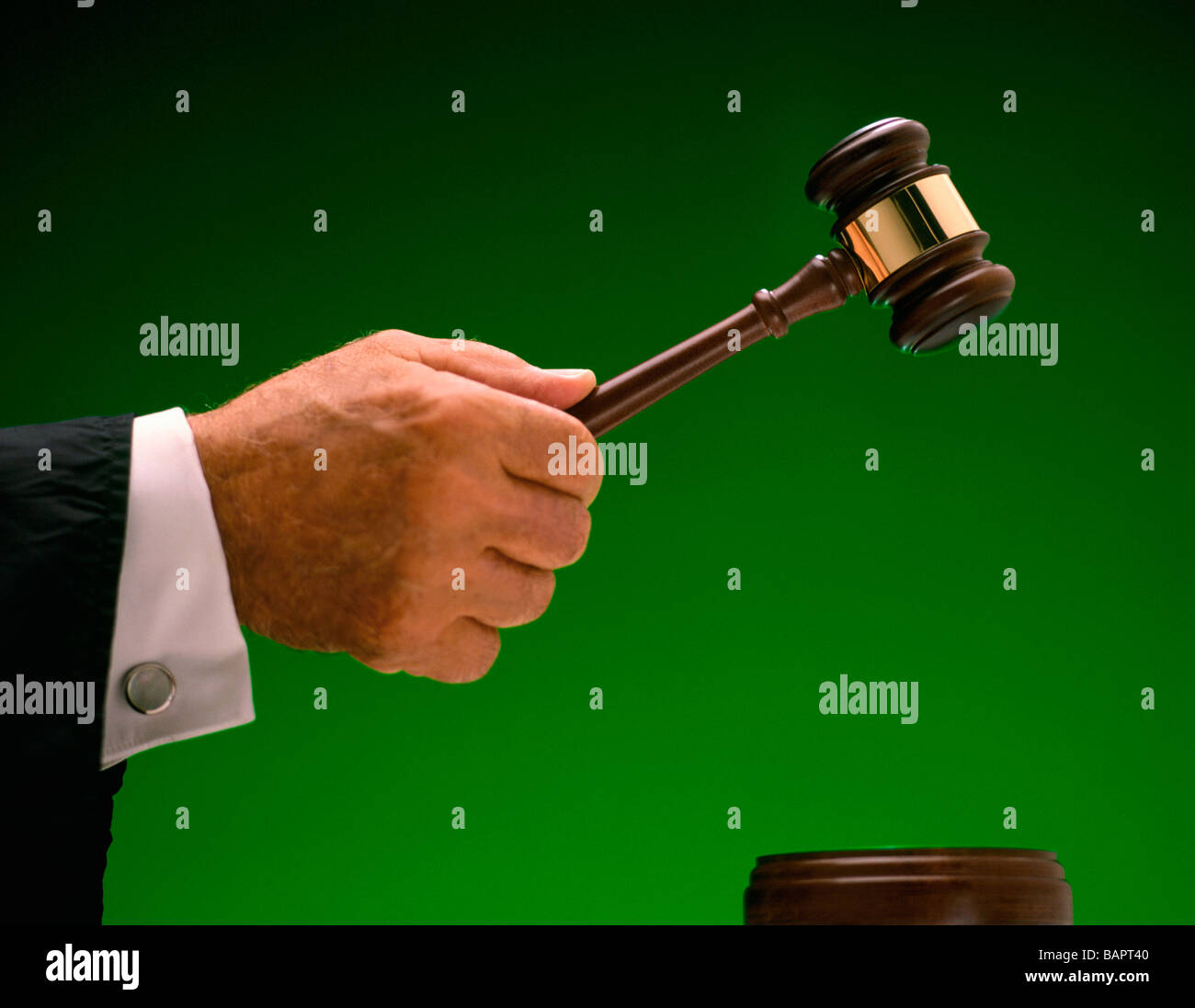 Hand with gavel Stock Photo - Alamy