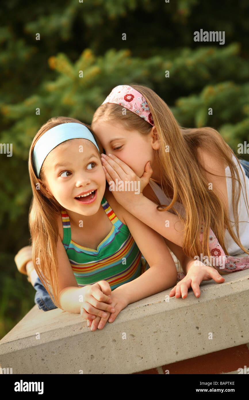 Girls sharing a secret Stock Photo - Alamy Girls sharing a secret Stock Photo - Alamy