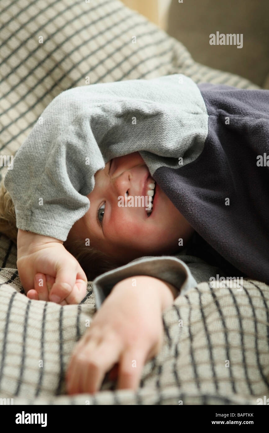 laughing boy laying down Stock Photo - Alamy