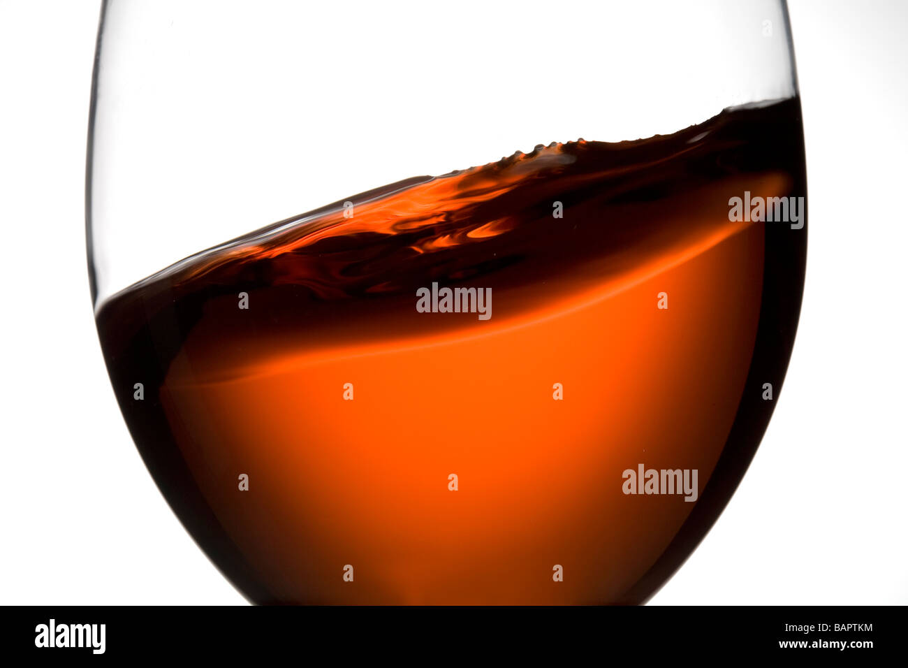 glass of rose wine swirling swirl Stock Photo - Alamy