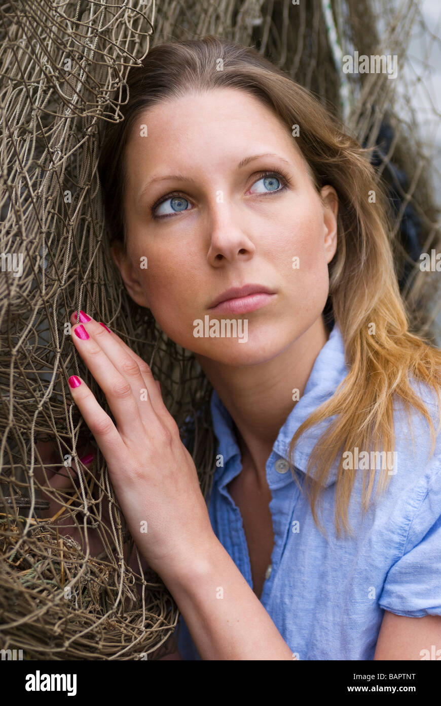 Woman posing with fish net hi-res stock photography and images - Alamy
