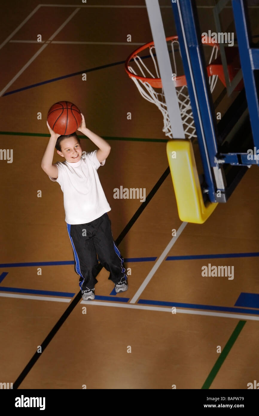 Boy playing basketball Stock Photo - Alamy