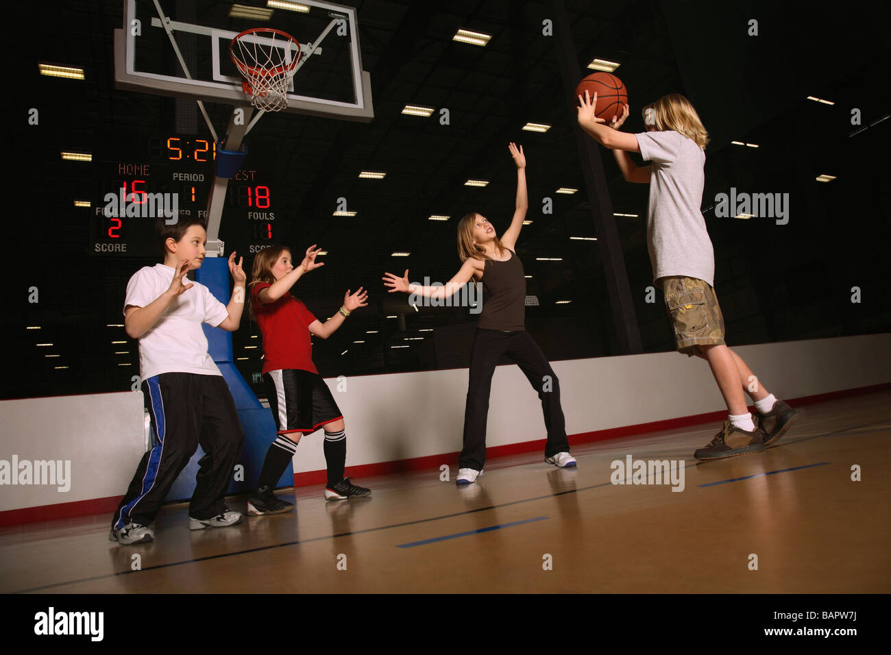 Group of teens playing basketball Stock Photo - Alamy