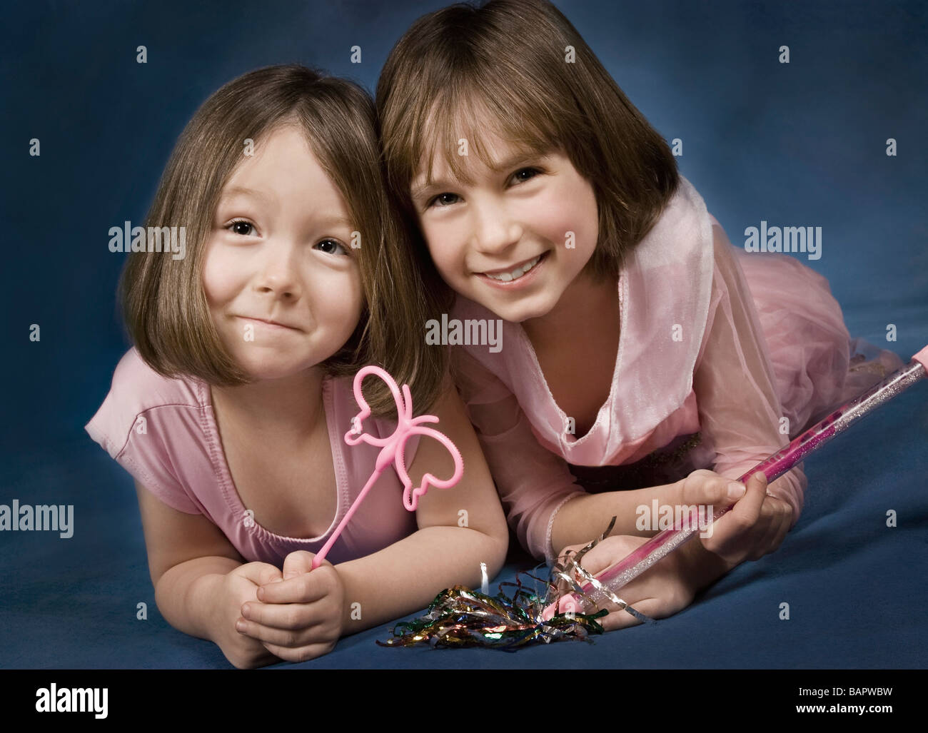 Two girls in pink Stock Photo - Alamy