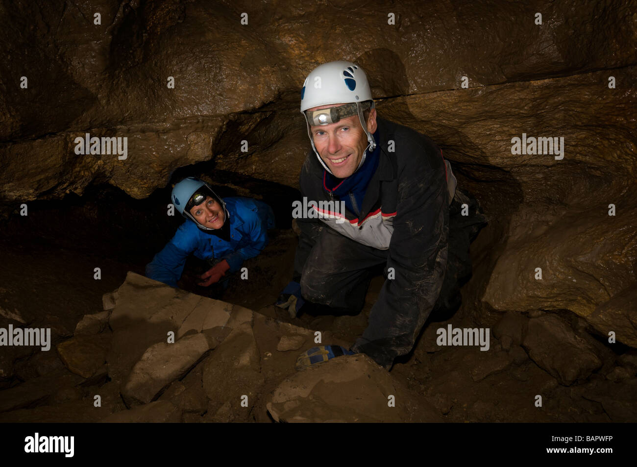 Men in a cave; spelunking Stock Photo - Alamy