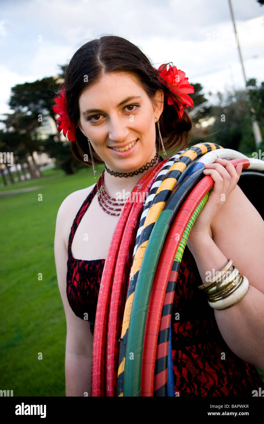 Circus hula hoop performer in the park Stock Photo - Alamy