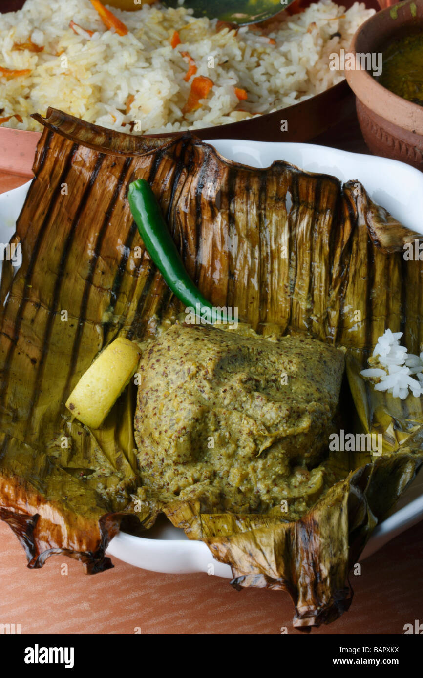 Bhetki paturi meaning fish seasoned with spices wrapped in banana ...