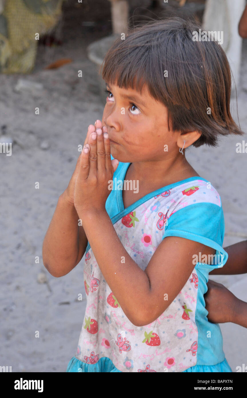 Moken kid put palms together wai and queue up to get sweet from tourist ...